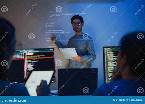 Asian And Indian Developer Team Brainstorming And Presentation About Ai Coding Project At Night