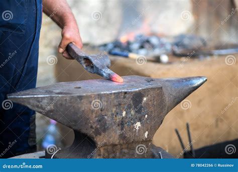Blacksmith Working On Metal On Anvil At Forge High Speed Detail Shot