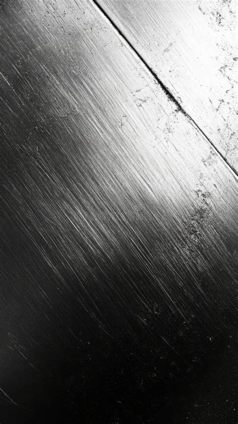Brushed Metal Surface With Scratches And A Diagonal Line Dividing The Light And Dark Areas Stock