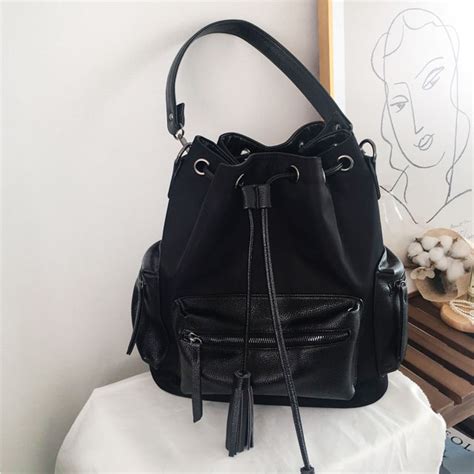 투웨이 프라다원단콤비 지퍼포켓 숄더겸용 복조리 백팩 에이블리