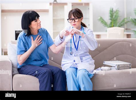 Doctor Examining Old Mature Woman After Incident Stock Photo Alamy