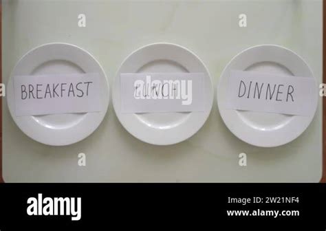 Empty Plates With Titles Breakfast Lunch And Dinner On A Table Woman