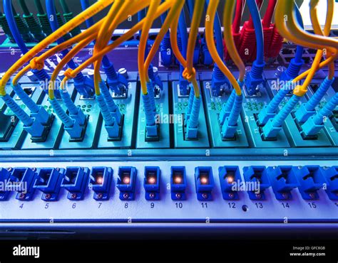 Fiber Network Switch With Some Yellow Optical Network Cables Stock