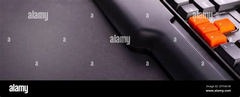 Orange Arrow Keys On A Black Keyboard Up Down Left Right Buttons On A Gaming Computer