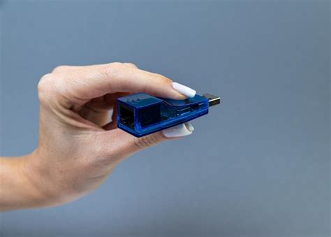 Premium Photo Hands Holding Various Converter Cables Adapters For Computers And Smartphones