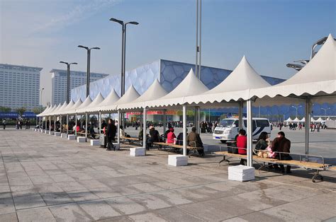 People Sitting On Benches Under White License Image 13887298