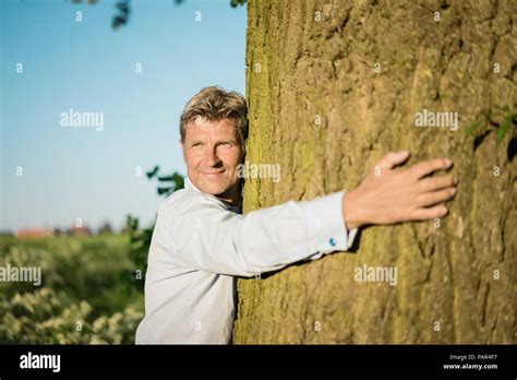 Man Tree Hugging Stock Photo Alamy