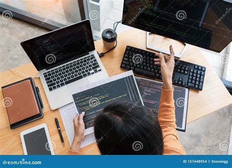 Asian Team Outsource Developer Looking Screen Programming Code Working