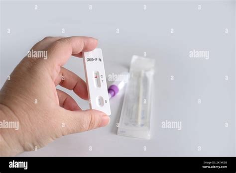 Closeup Female Hand Holding Test Cassette Medical Disposable Sterile Test Kit For Rapid Test
