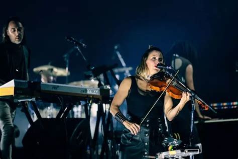 Review Arcade Fire Bring Dystopian Visions And Euphoric Anthems To