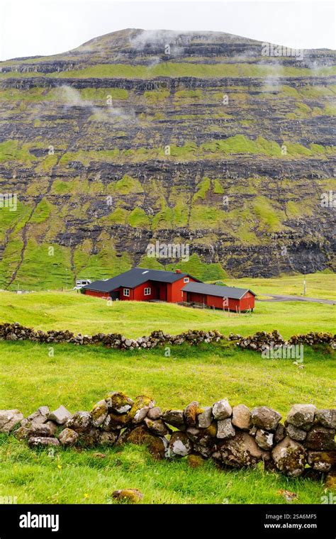 Breathtaking Faroe Islands Scenery With Traditional Red House With