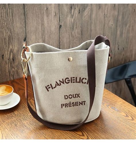 캔버스 가방 여성 숙 녀 핸드백 2022 새로운 한국어 대학생 단추 편지 캐주얼 메신저 양동이 티몬