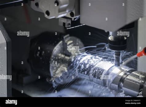 A Modern Cnc Machine Produces A Piece Of Metal Part Using The Milling Method Stock Photo Alamy