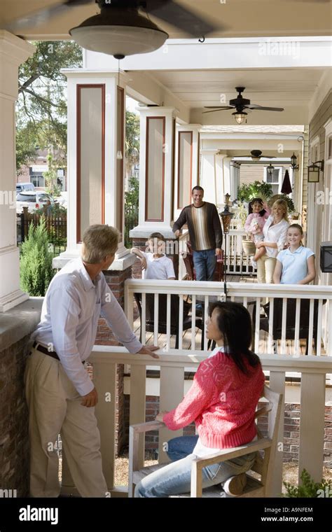 Next Door Neighbors On Front Porches Stock Photo Alamy