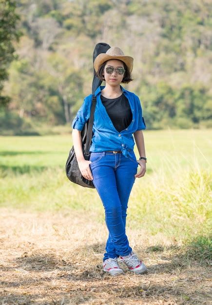 Premium Photo Portrait Of Girl Wearing Hat While Standing On Grass
