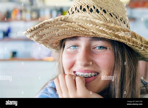 Pre Teen Girl Smiling Directly At Camera And Showing Her Orthodontic