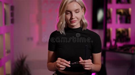 Beautiful Girl Barber Posing While Standing In A Fashionable Barbershop