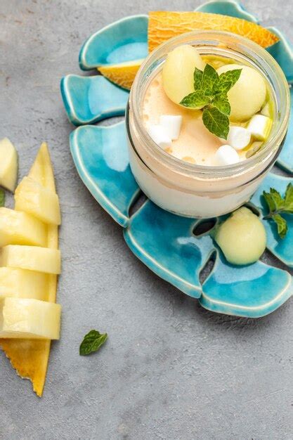 Premium Photo Delisious Ice Cream With Melon And Mint In A Glass Jar Food Recipe Background