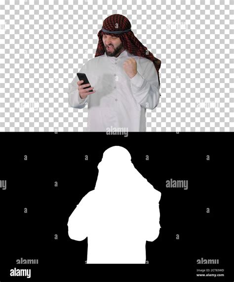 Arab Sheikh Wearing Keffiyeh Receiving Grate News On The Phone Stock