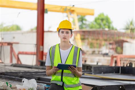 Senior Engineer And Female Foreman Team Checking Project At Precast Concrete Factory Site