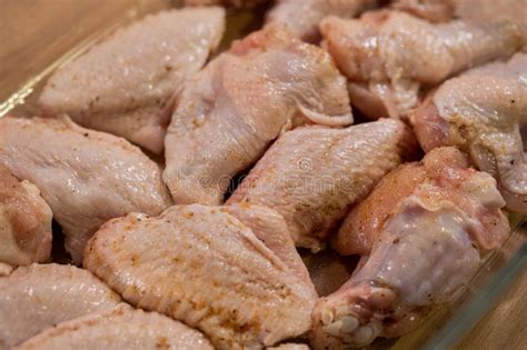 Raw Chicken Wings In Spices In A Baking Dish Cooking At Home Stock