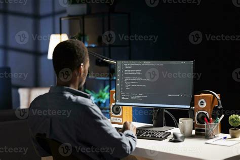 Male Developer Entering Binary Data On Terminal Panel While