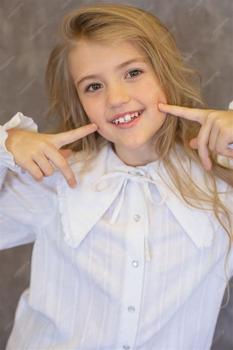 Premium Photo Portrait Of A Beautiful Longhaired Blonde Girl In A