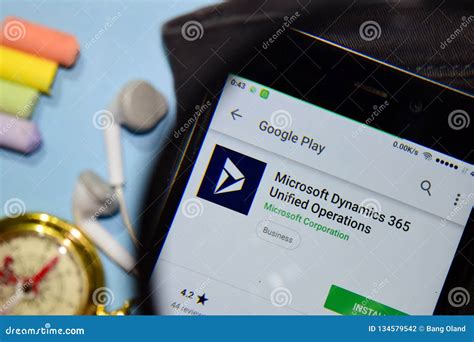 Microsoft Dynamics 365 Unified Opeartions Dev App With Magnifying On Smartphone Screen