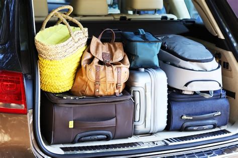 Premium Photo Suitcases And Bags In Trunk Of Car Ready To Depart For