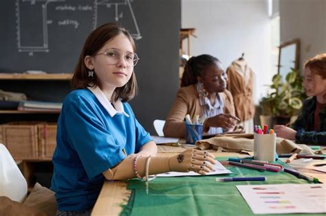 Premium Photo Girl With Prosthetic Hand In Tailoring Class