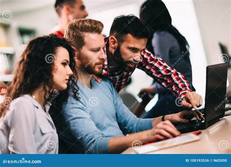 Portrait Of Programmers Working In Development Software Company Stock