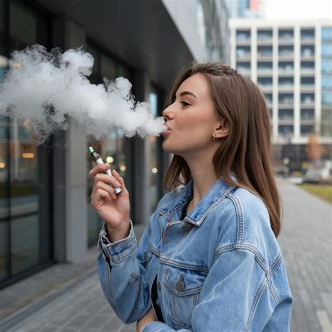 Vaping Young Beautiful Woman Smoking E Cigarette With Smoke Outdoors