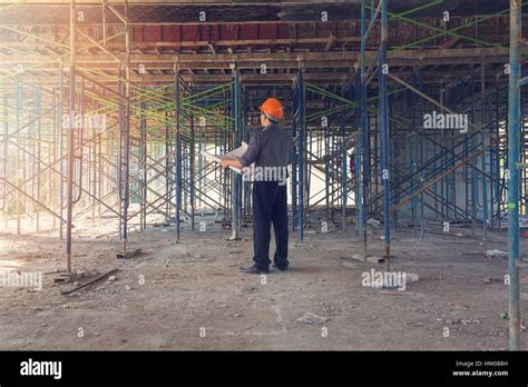 Construction Concepts Engineer And Architect Working At Construction Site With Blueprint