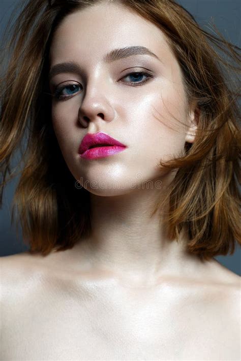 A Young Girl With Crimson Lips And Fluttering Hair Beautiful Model With Makeup Nude And Shining