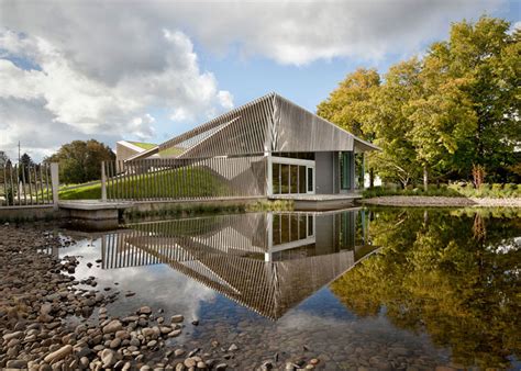 water treatment facility by skylab architecture with a grassy fin roof