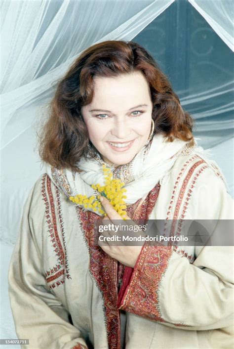 Portrait Of Italian Actress Laura Antonelli Holding A Bunch Of
