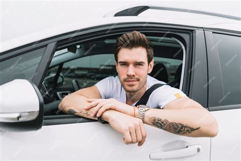 Free Photo An Attractive Young Man Looking Out Of Car Window