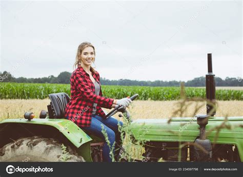 Female Farmer On Tractor
