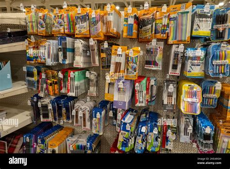 Various Stationary Items Ie Penspencils Tape On Hooks And Shelves At