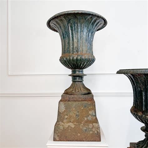 Pair Of High Victorian Cast Iron Campana Urns On Plinths For Sale At