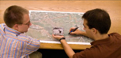 Two Researchers Use A Map Based Query To Retrieve A Geo Tagged Photo On