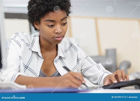 Female Worker Calculating Invoice With Calculator In Office Stock Image Female Worker Calculating Invoice With Calculator In Office Stock Image