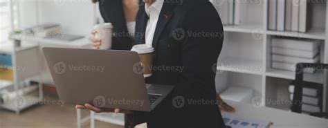 Business Professionals Group Of Young Confident Business People Analyzing Data Using Computer