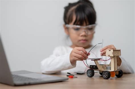 Premium Photo Asia Students Learn At Home In Coding Robot Cars And