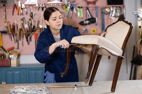 Young Female Furniture Workshop Worker Designing Vintage Chair Stock