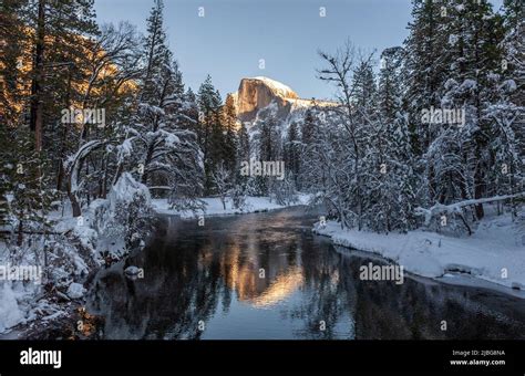 The Peak Of Half Dome Is Baking In The Full Light Of The Setting Sun It Is Reflected In The
