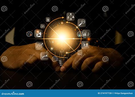 Businessman Touching Glowing Light Bulb With Learning Icon For Education Knowledge And Goals