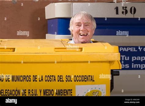 Senior Man Inside Recycle Bin With Just Head Showing And Smiling Stock Photo Alamy