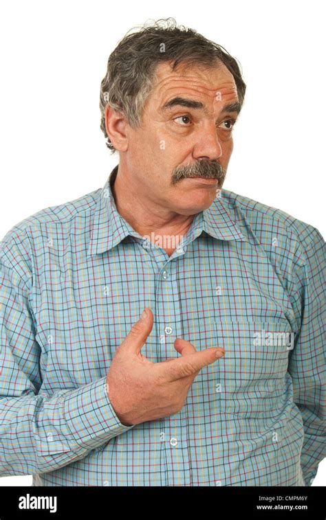 Mature Business Man Thinking And Being Confuse Pointing To A Side Isolated On White Background