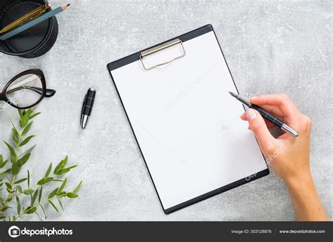 Woman Hand Holding Pen And Write A Message In Blank Paper Clipboard Feminine Home Office Desk